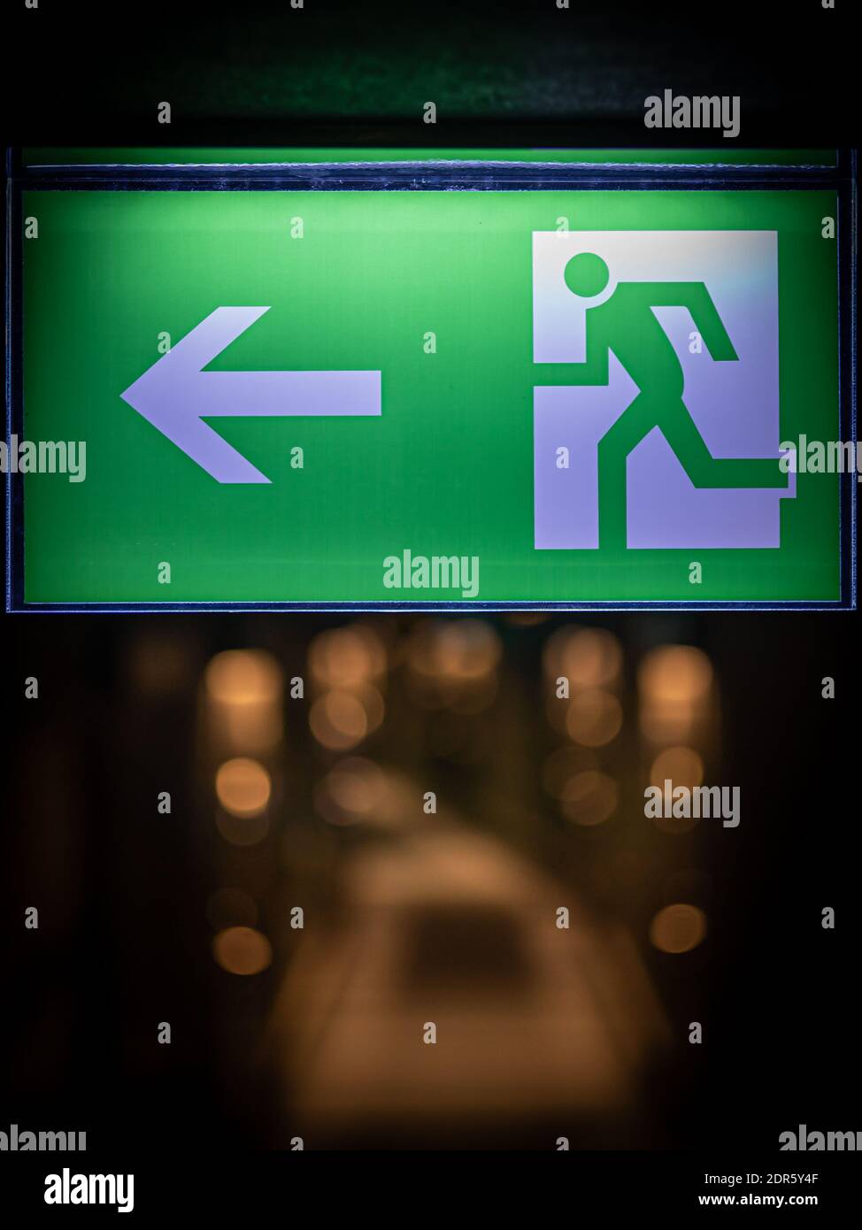 green emergency exit sign in hotel showing the way to escape Stock ...