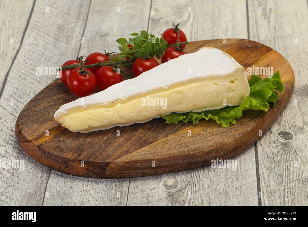 Brie cheese triangle served salad leaves Stock Photo - Alamy
