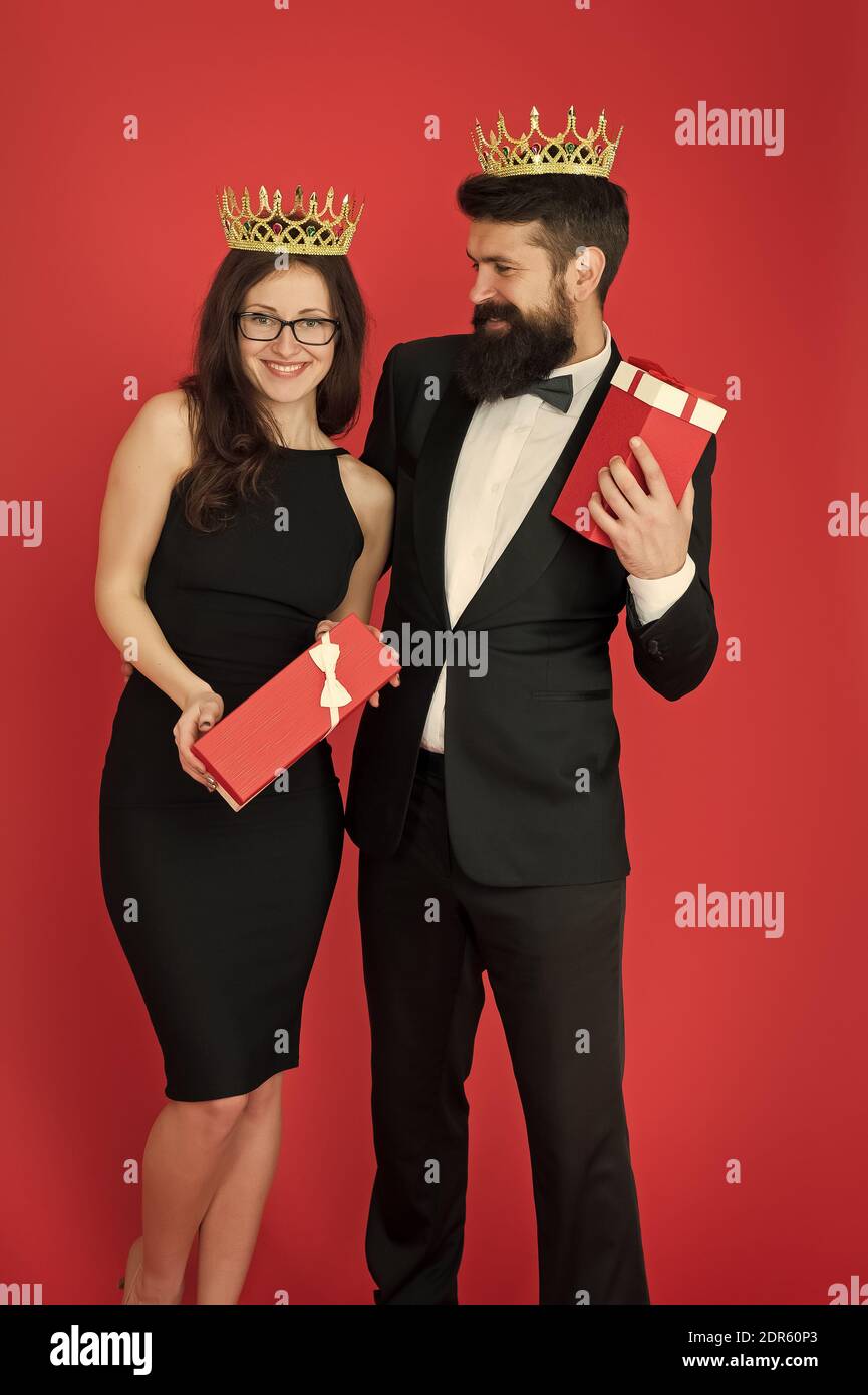 Beautiful people celebrate success. Couple in love wear crowns red ...