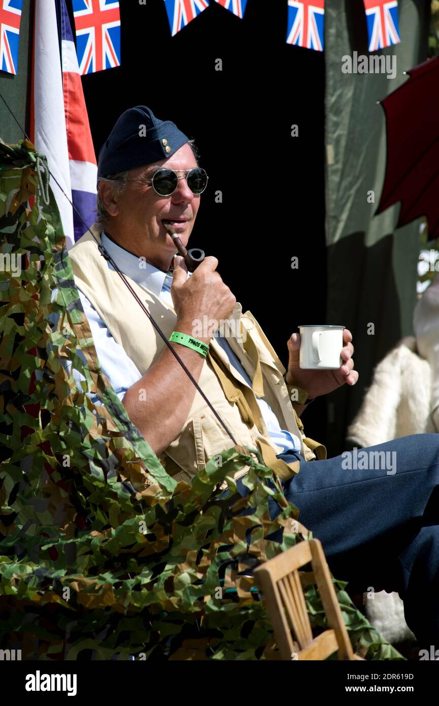 RAF Airman Smoking A Pipe & Holding A Cup Of Tea During A 1940's ...