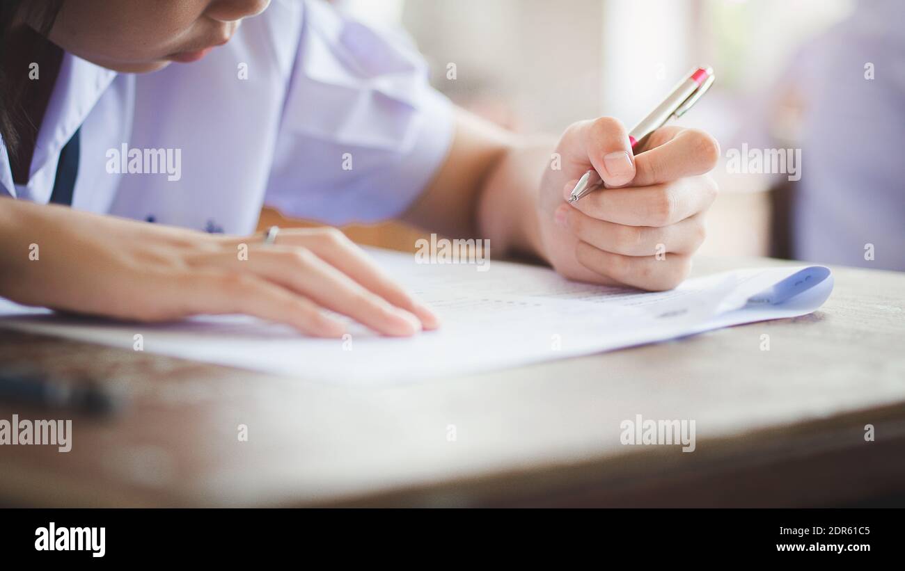 Students taking exam with stress in school classroom Stock Photo - Alamy