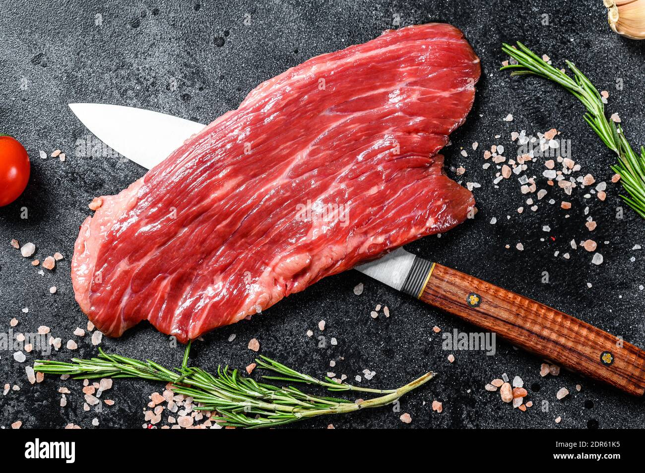 Raw Flank steak black Angus. Fresh Marble beef meat. Black background ...