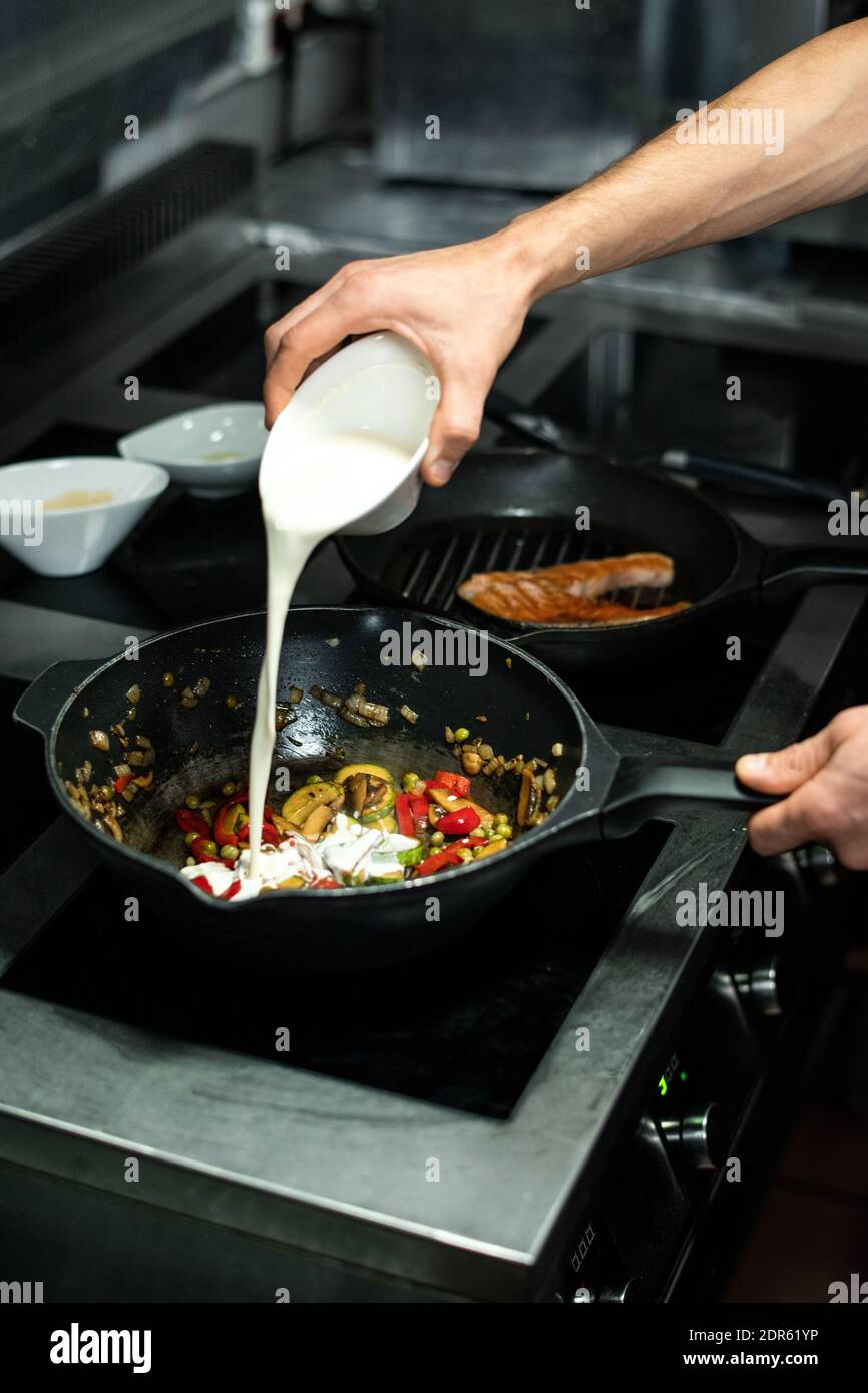 Mixing in frying pan champignons hi-res stock photography and images ...