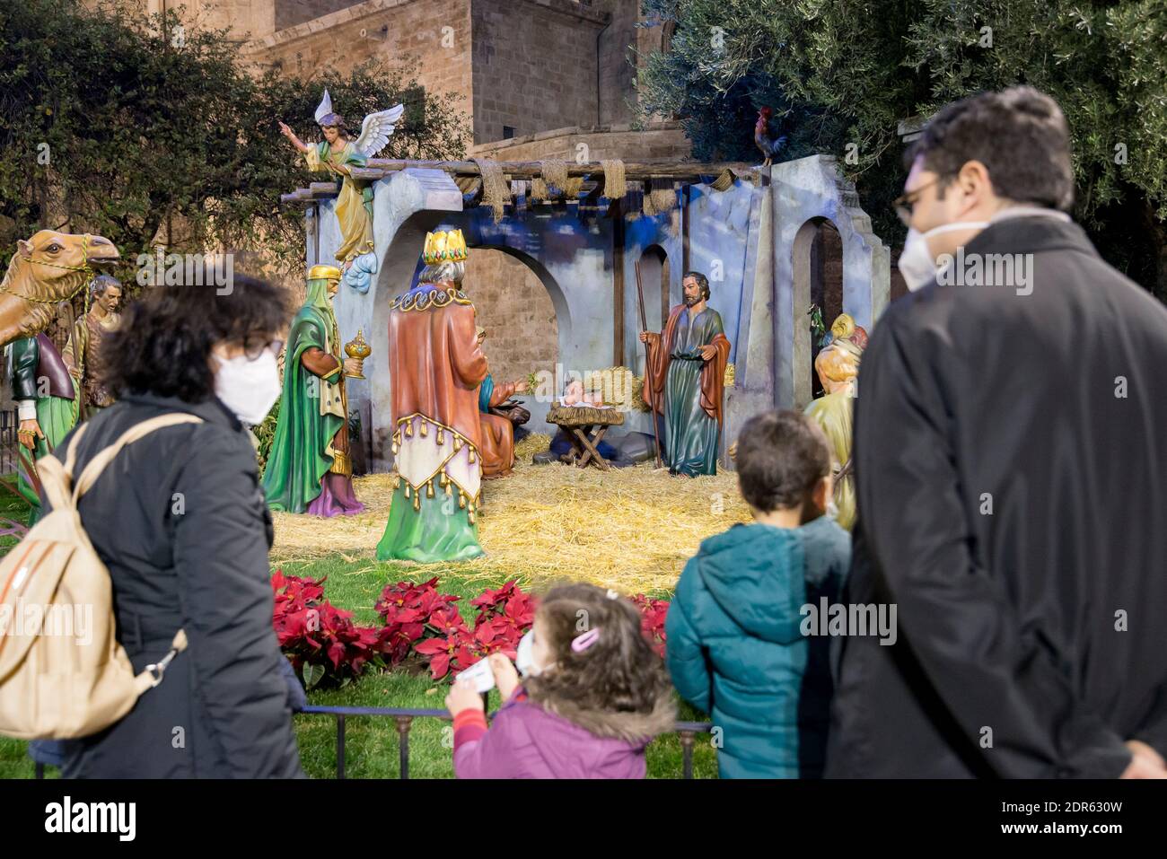 A family wearing face masks as a precaution against the spread of covid ...