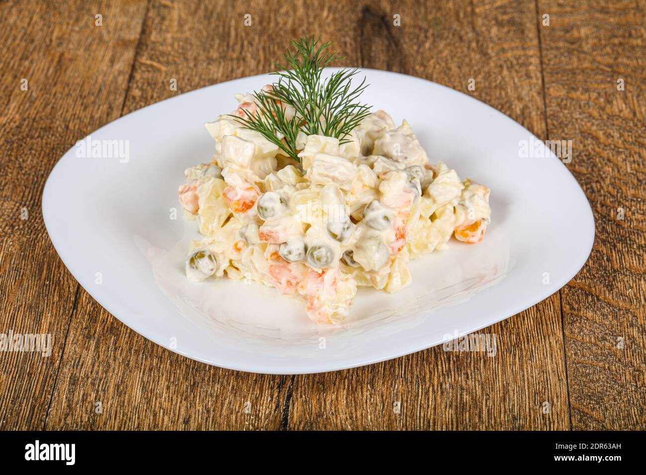 Traditional Russian salad with mayonnaise and meat Stock Photo - Alamy