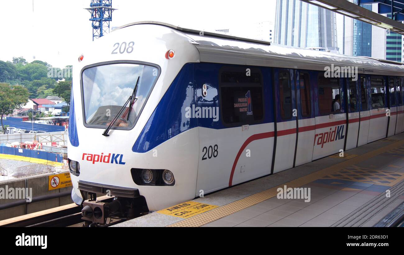 KUALA LUMPUR, MALAYSIA - 12 APRIL 2015: A RapidKL LRT train pulls into ...