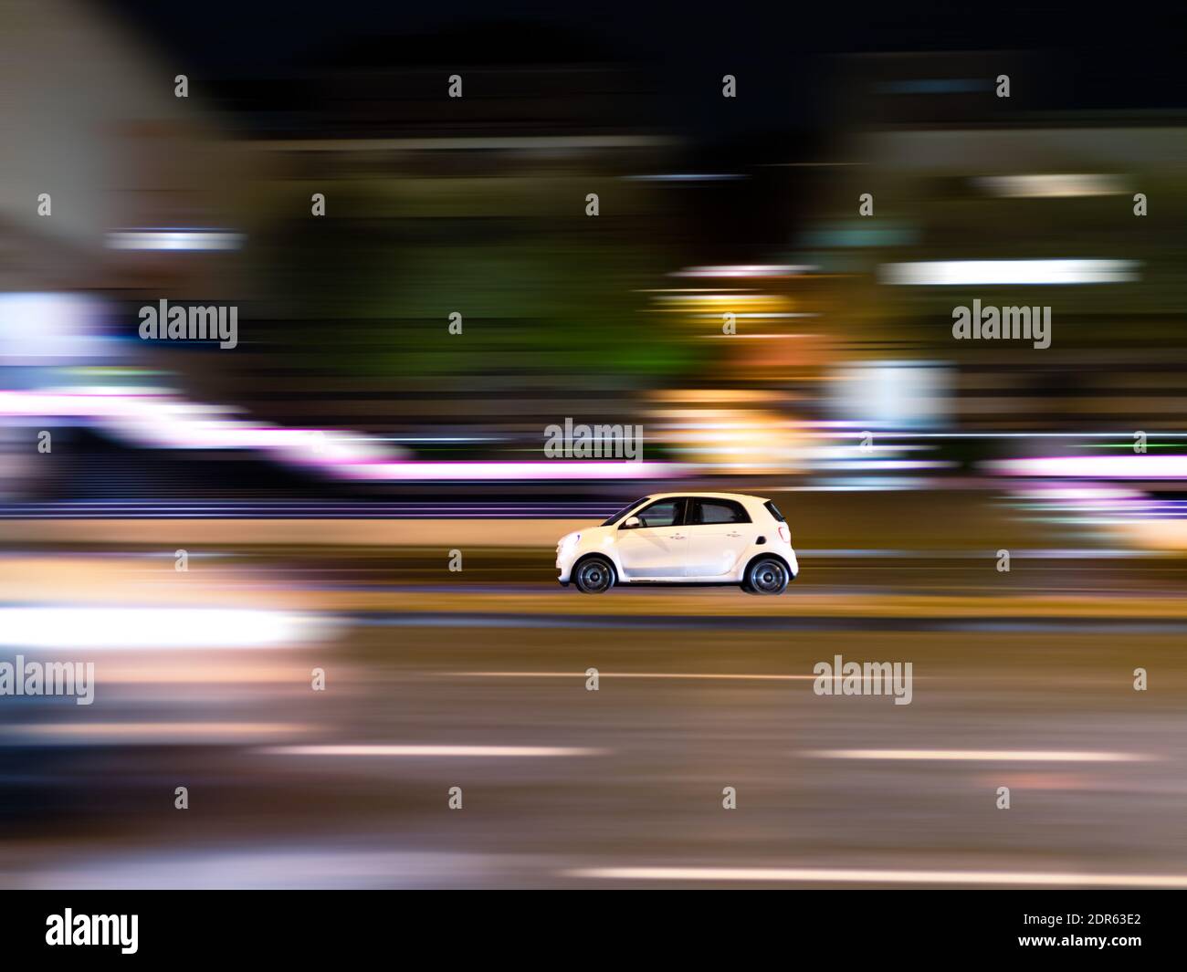 A speeding car driving on a highway with motion blur Stock Photo - Alamy