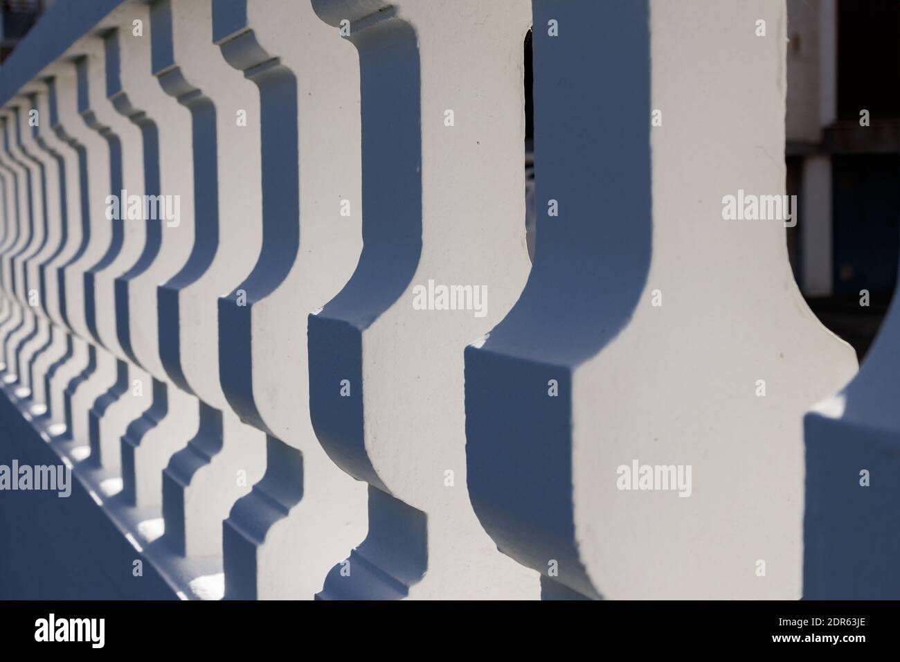 A perspective view of a row of whitewashed symmetric columns Stock ...