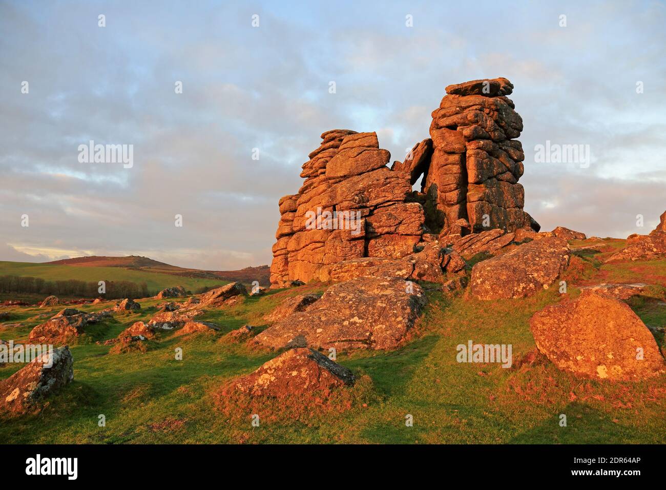 View of Rock Stacks on Hound Tor at sunset looking towards Honeybag Tor ...