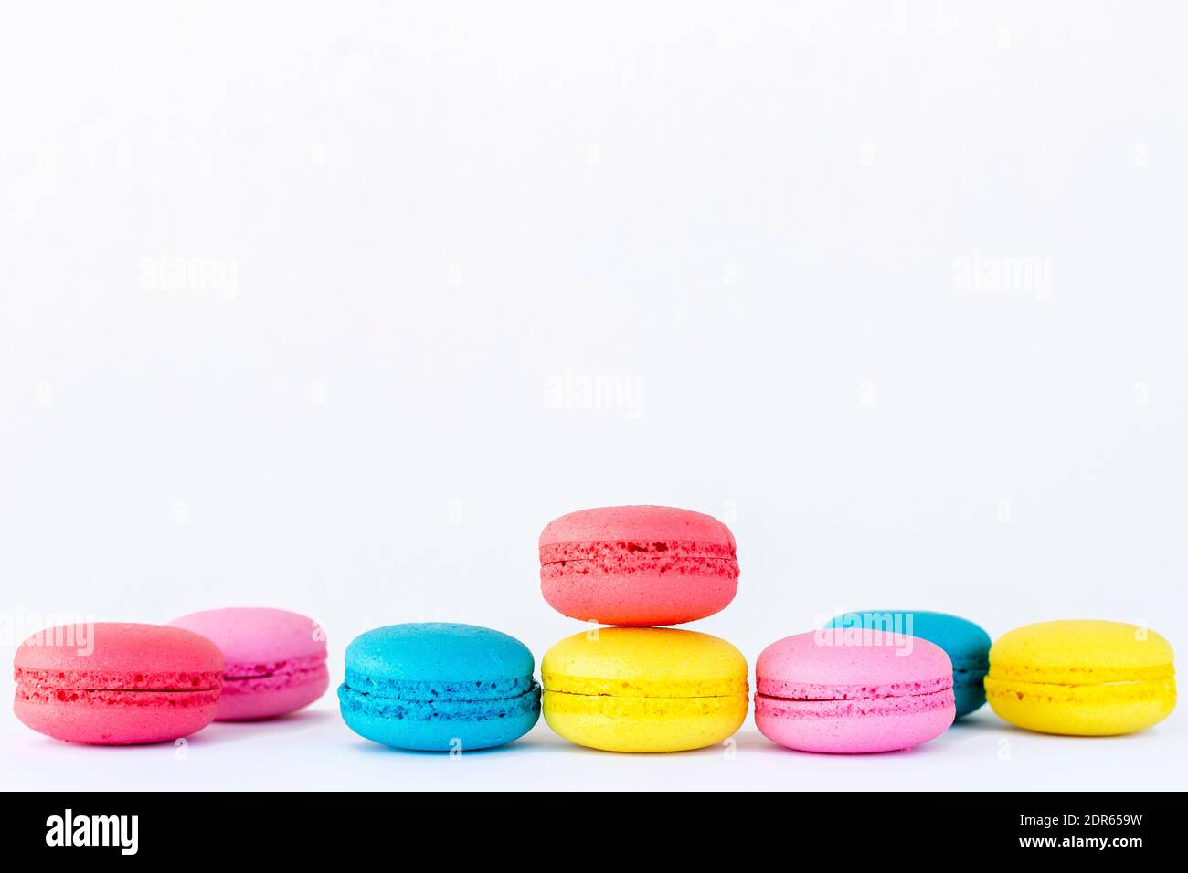 Colored macarons lined up on top of each other Stock Photo - Alamy