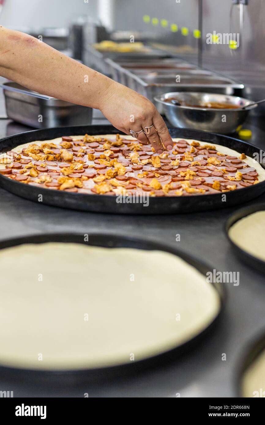 Making of a traditional italian pizza in the kitchen Stock Photo - Alamy
