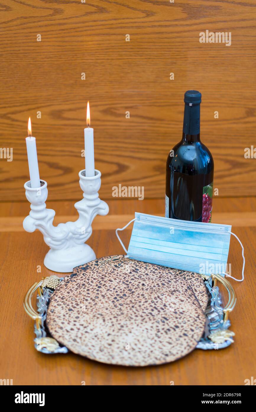 Corona Passover. Dust mask, bottle of wine and matzah - a traditional ...