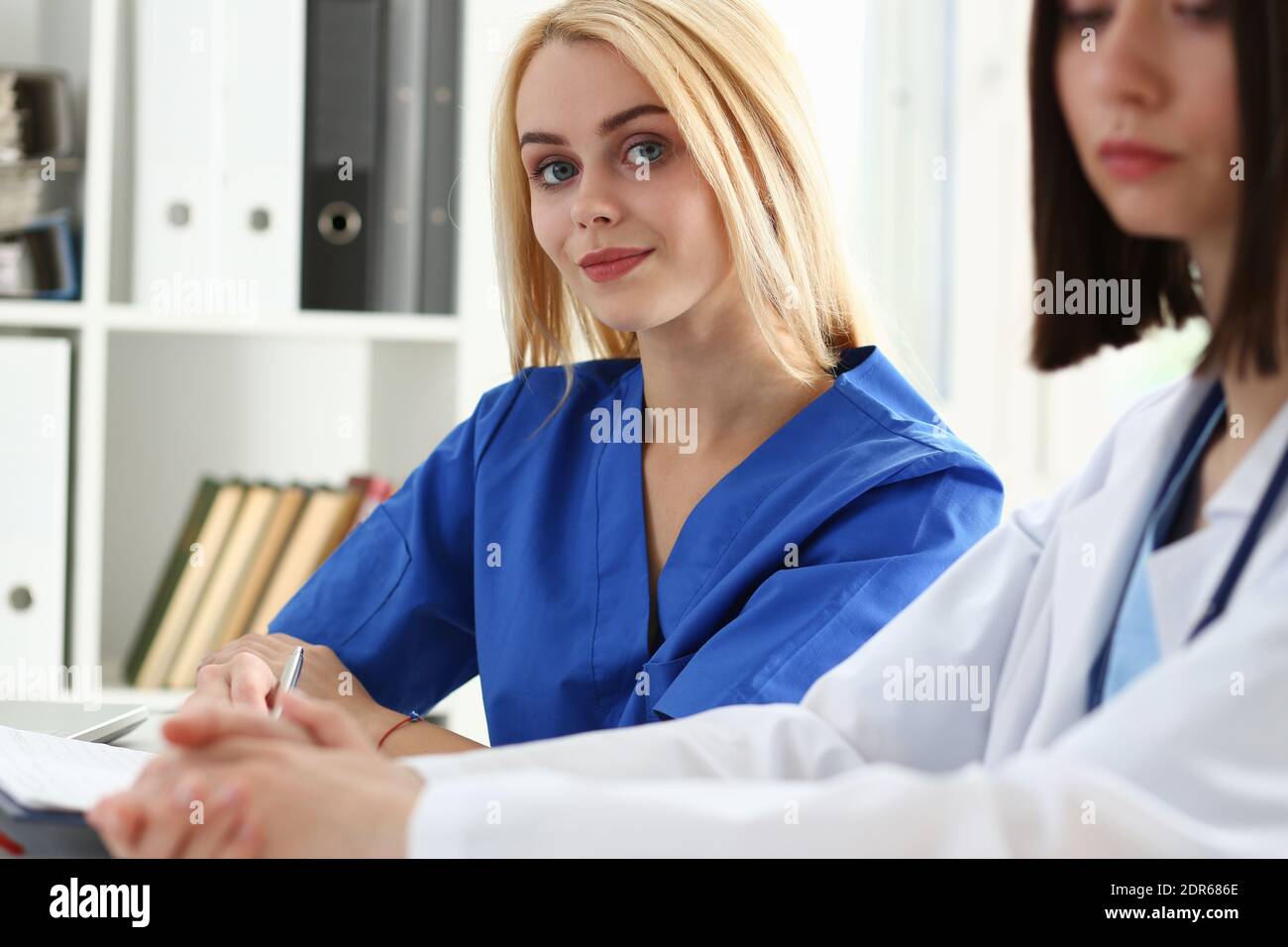 Group of doctors talking during conference portrait Stock Photo - Alamy