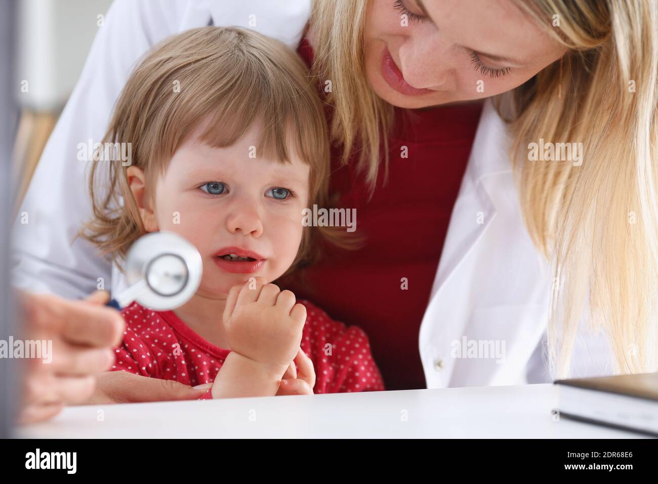 Little scared child at doctor reception Stock Photo - Alamy