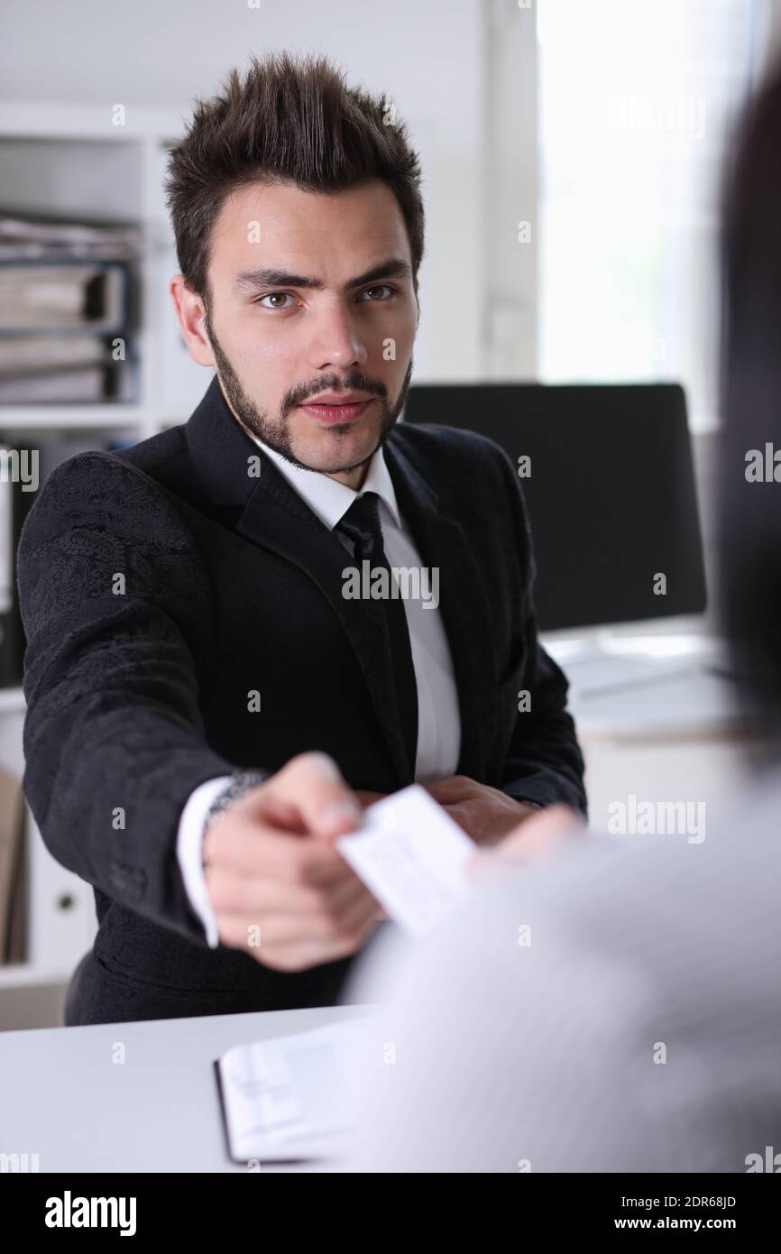 Male hand in suit give blank calling card Stock Photo - Alamy