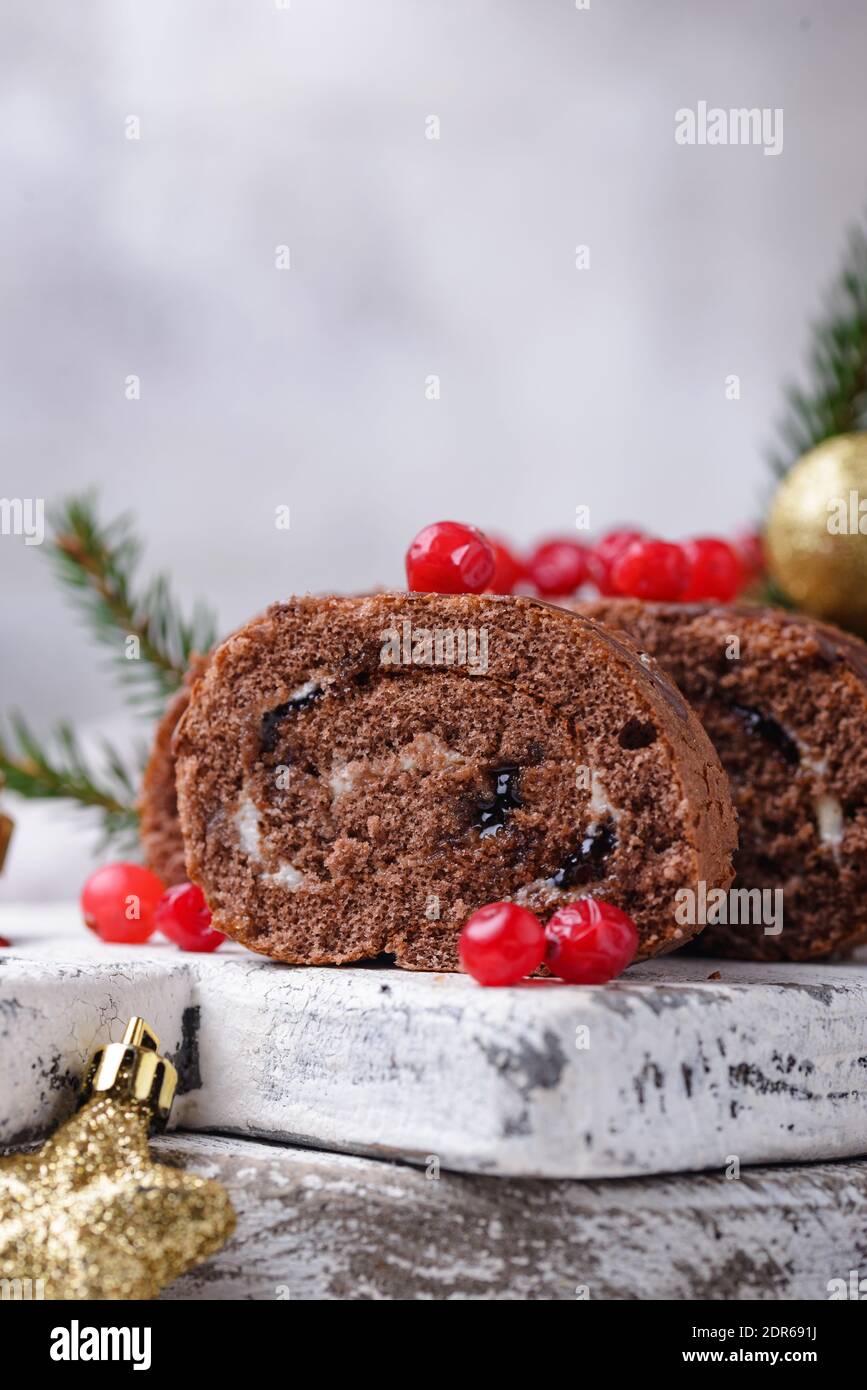 Christmas chocolate roll cake with cream Stock Photo - Alamy