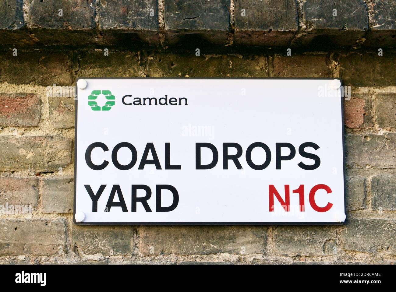 Coal Drops Yard street sign on brick wall in London Borough of Camden ...