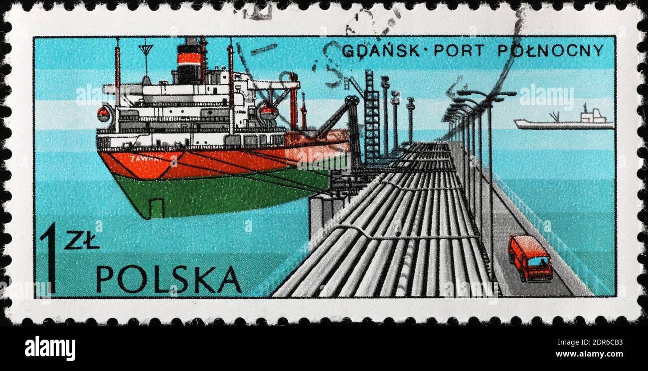 Tanker ship at a dock on polish postage stamp Stock Photo - Alamy