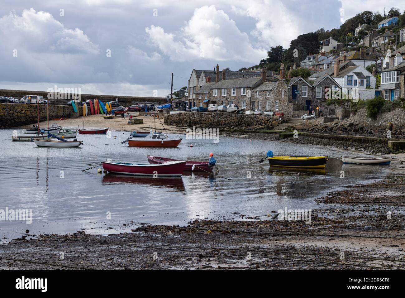 Mousehole fishing village Harbour in Cornwall on an overcast summer’s ...