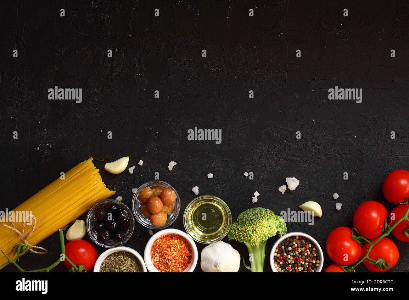 Italian Food background on black stone table. Top view Stock Photo - Alamy