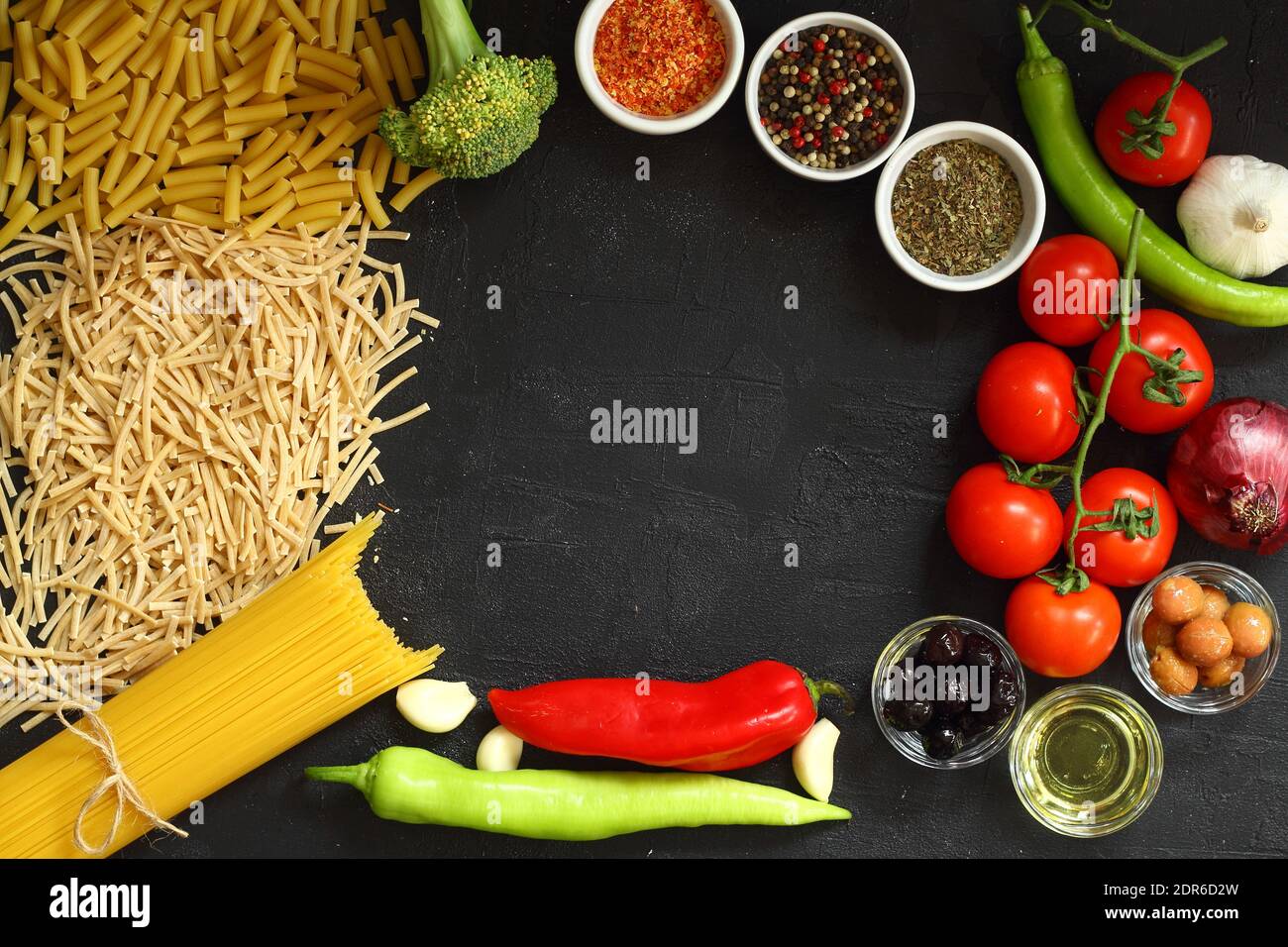 Italian Food background on black stone table. Top view Stock Photo - Alamy