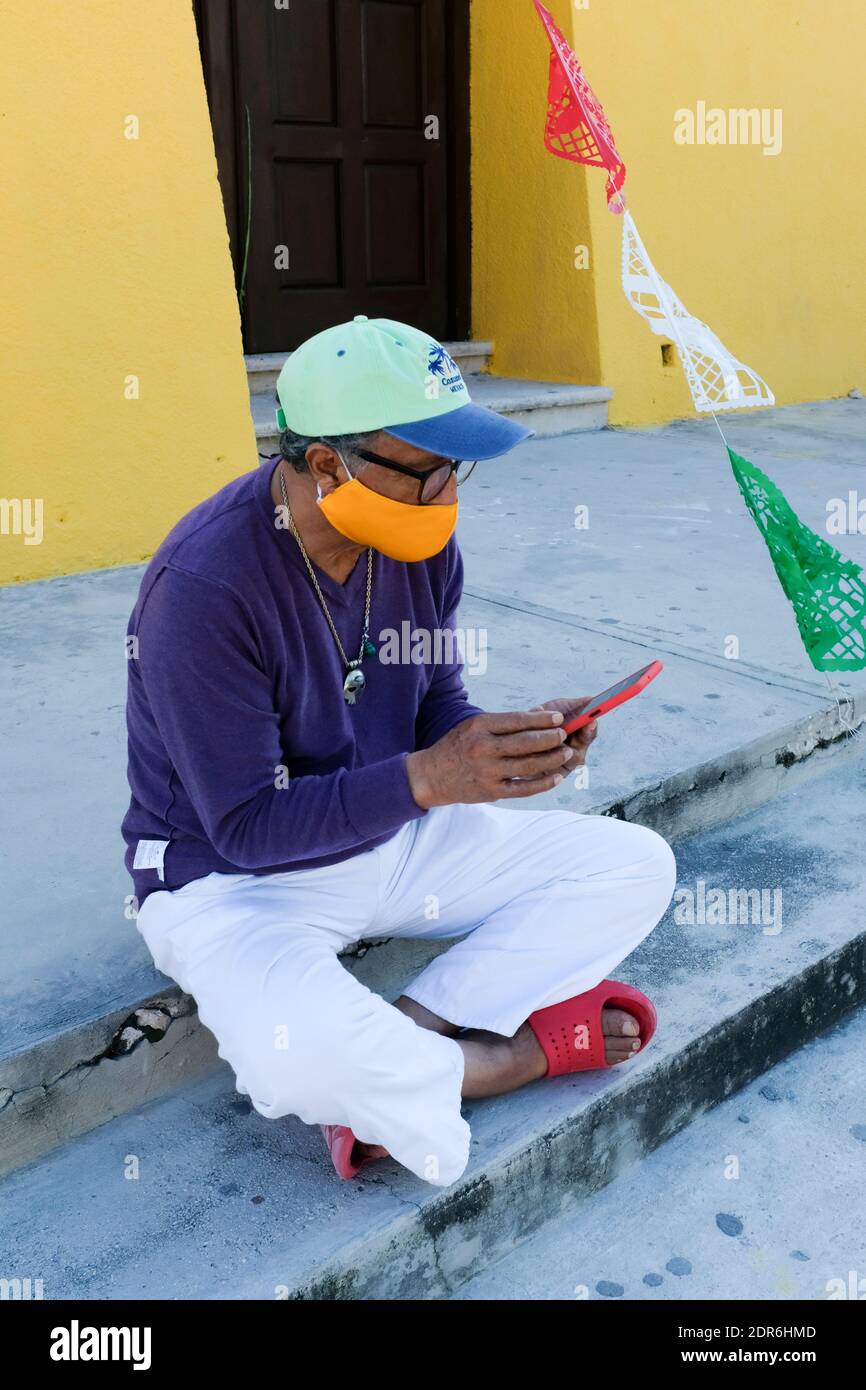 Mexican man using his phone to track the Covid-19 Pandemic , Yucatan ...