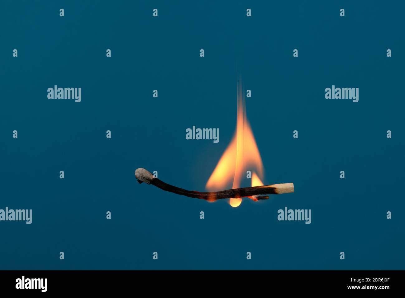 Burning Matchstick floating weightlessly Stock Photo - Alamy