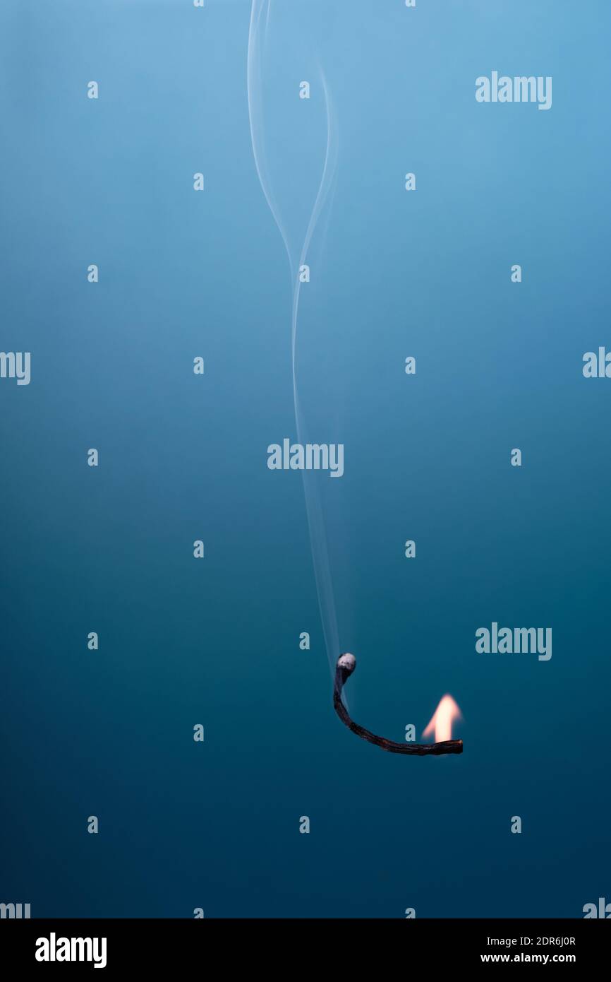 Burning Matchstick floating weightlessly Stock Photo - Alamy