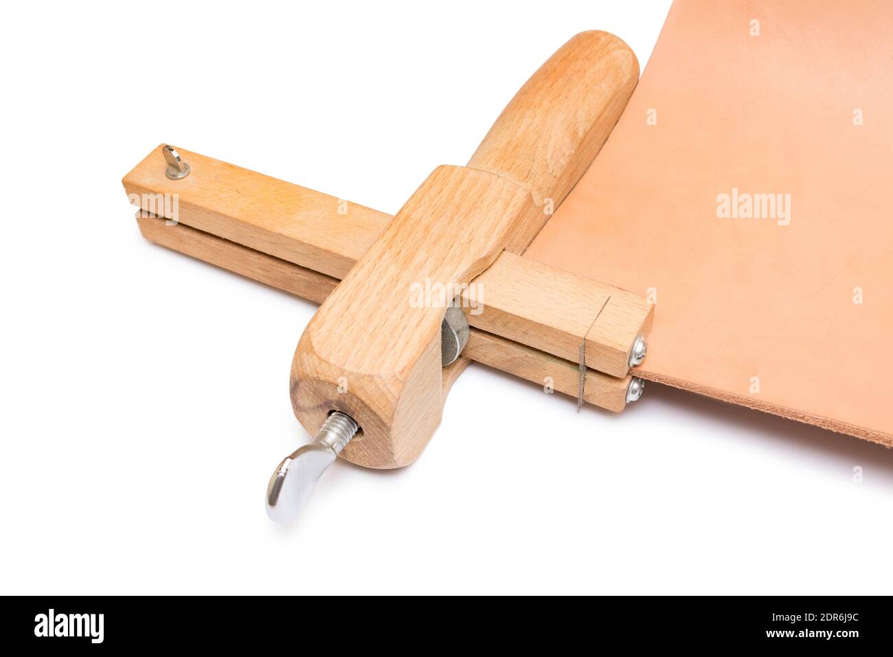 A tool for cutting belts and a piece of genuine leather Stock Photo - Alamy