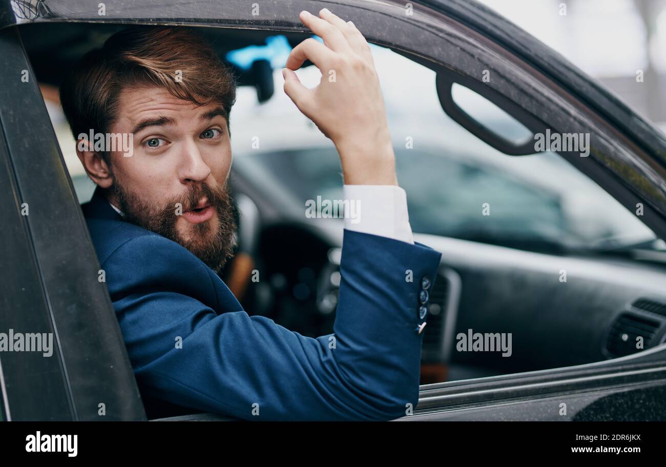 business man peeking out of the car window trip professional Stock ...