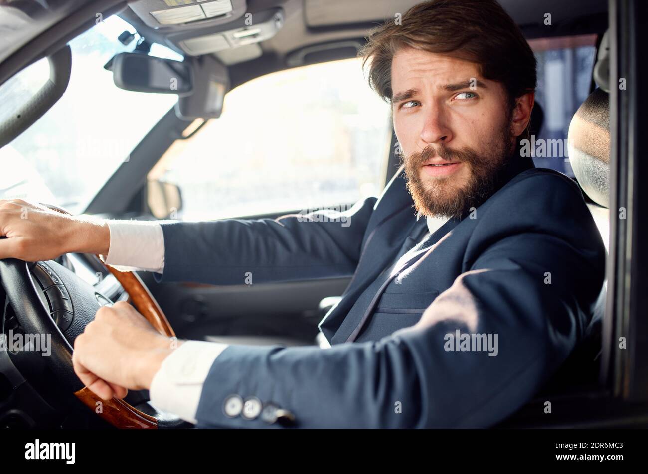business man in suit driving a car trip luxury road Stock Photo - Alamy