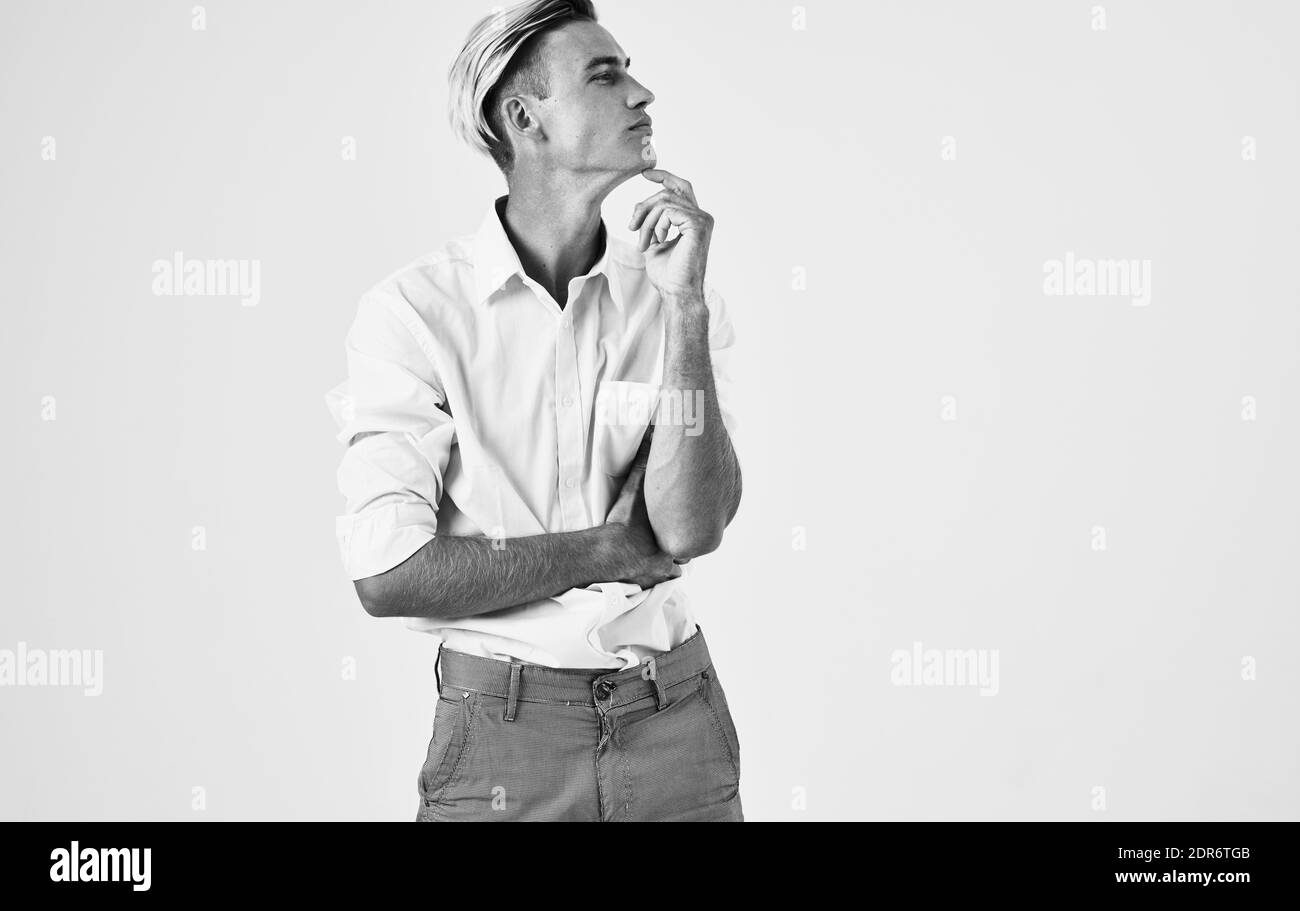 portrait of a man in a shirt and trousers puzzled look cropped view ...