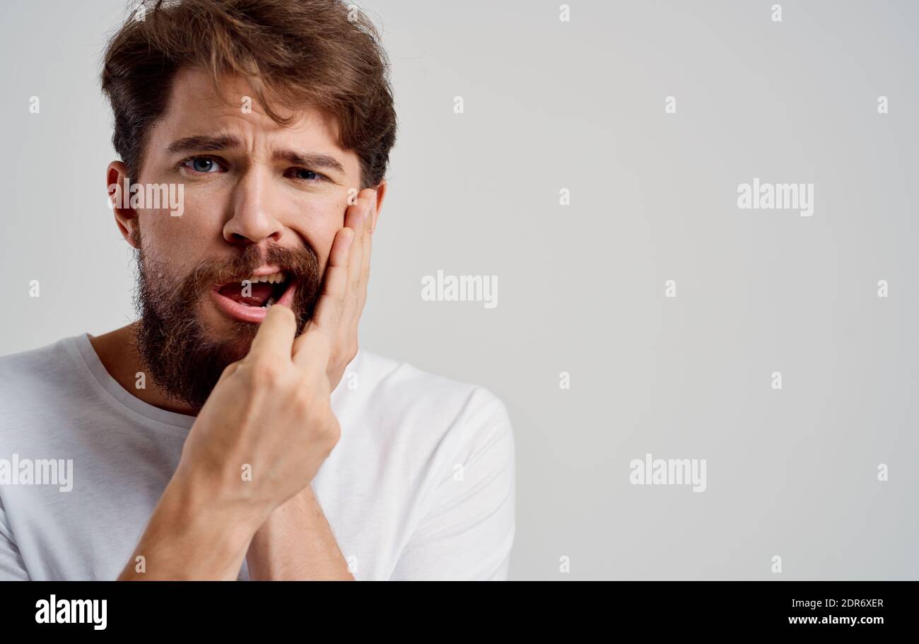 bearded man health problems dental pain injury Stock Photo - Alamy