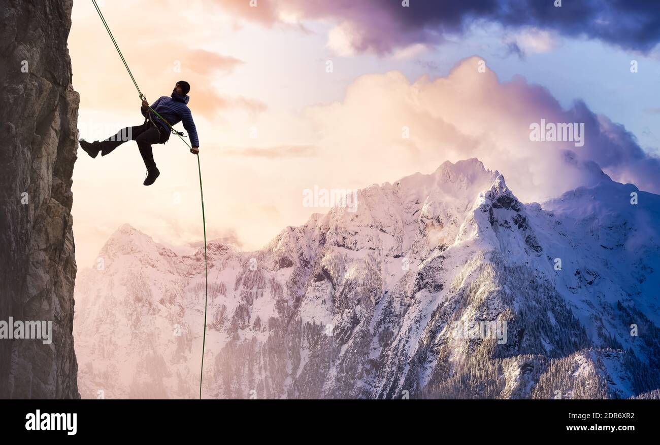 Rock climbing man rappelling hi-res stock photography and images - Alamy