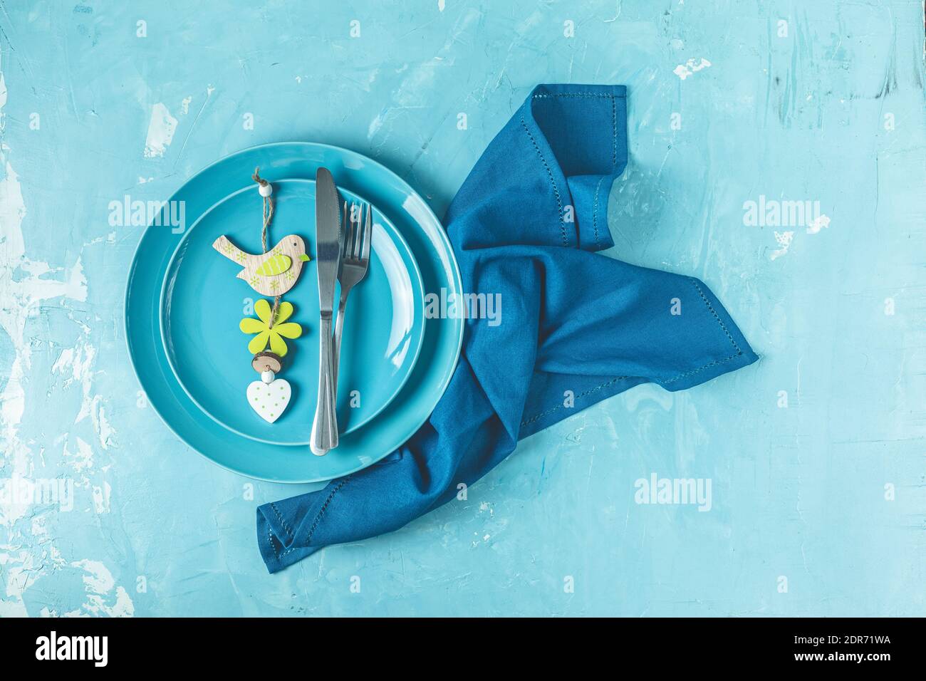 Easter simple table setting. Light blue colored table setting Stock ...