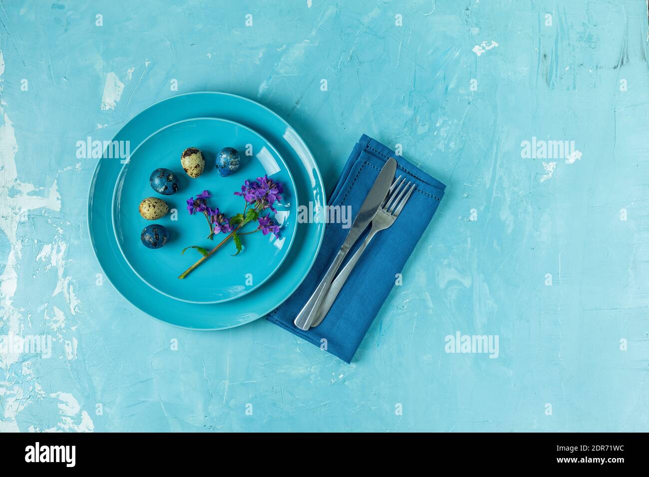Easter simple table setting. Light blue colored table setting Stock ...