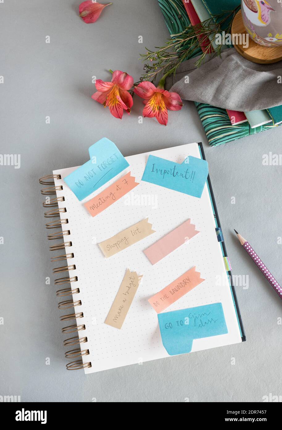 Empty spiral notebook full of multicolor reminder notes at the top of ...