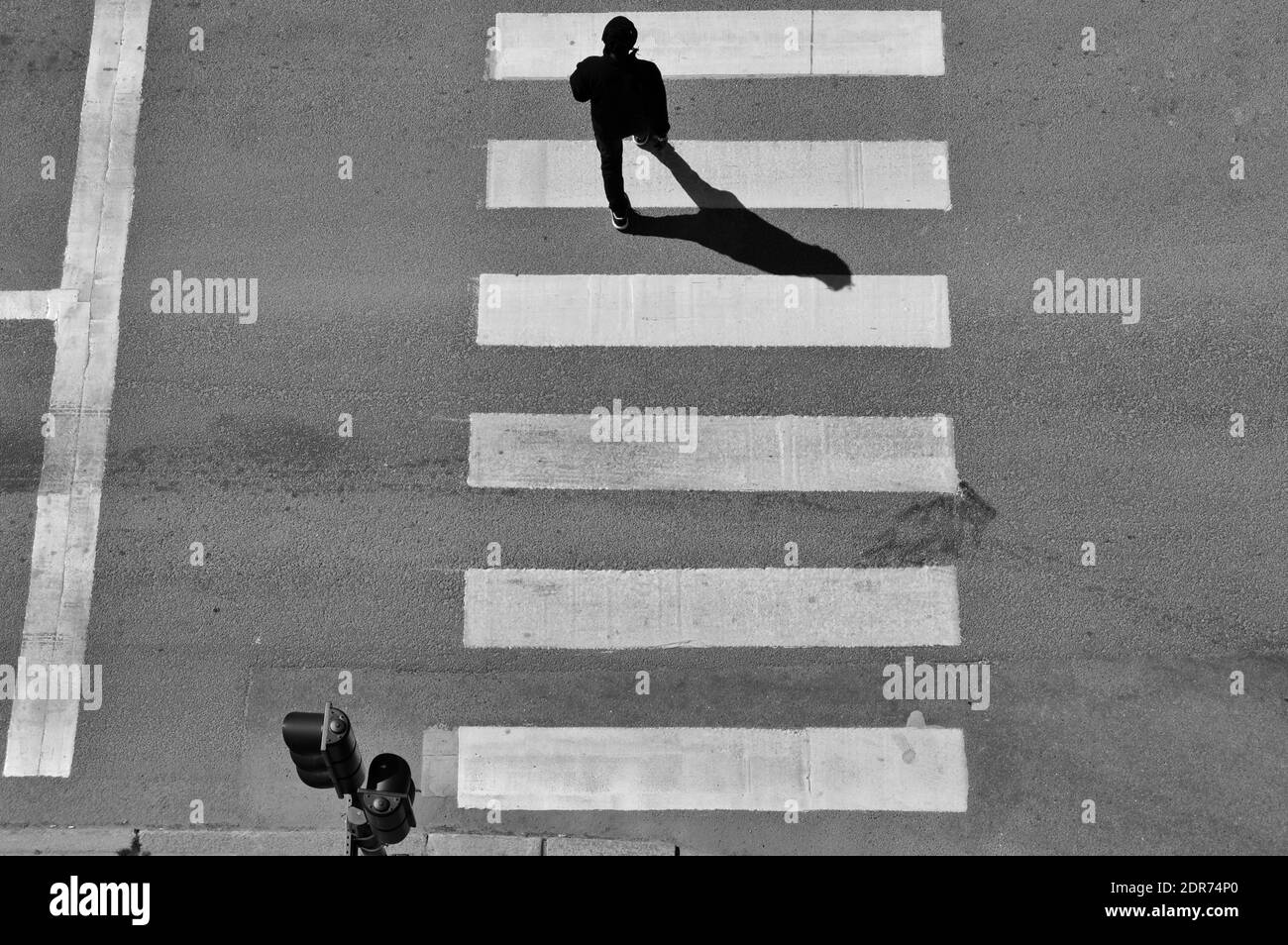 Man crossing road crossing Black and White Stock Photos & Images - Alamy
