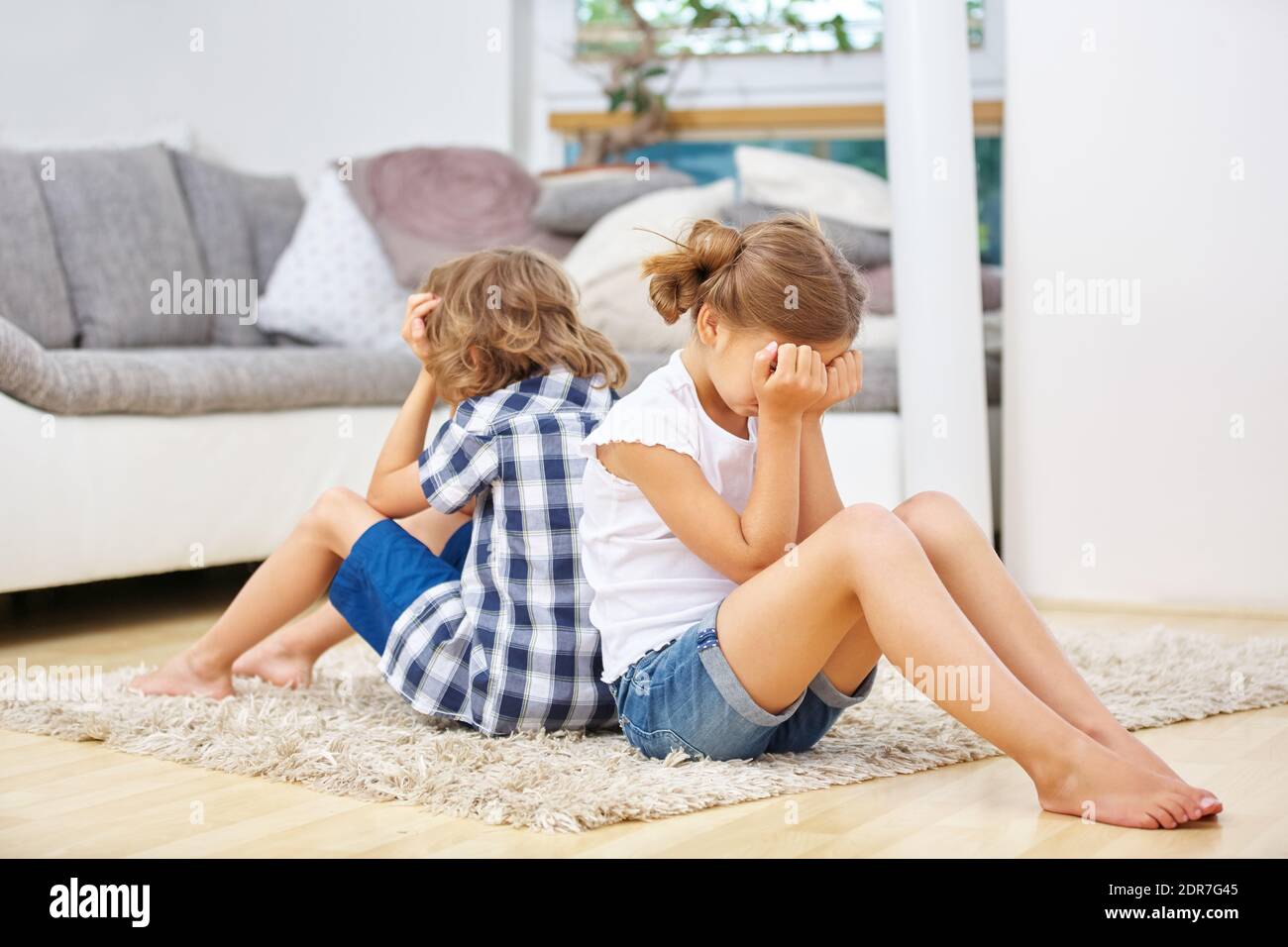 Two boys sitting sad hi-res stock photography and images - Alamy