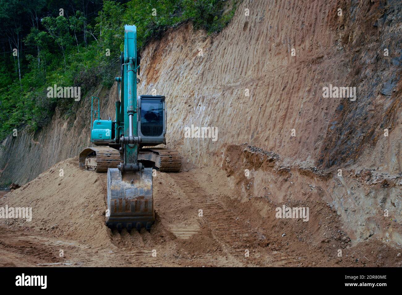 Excavator during excavation at construction site. Excavator working ...