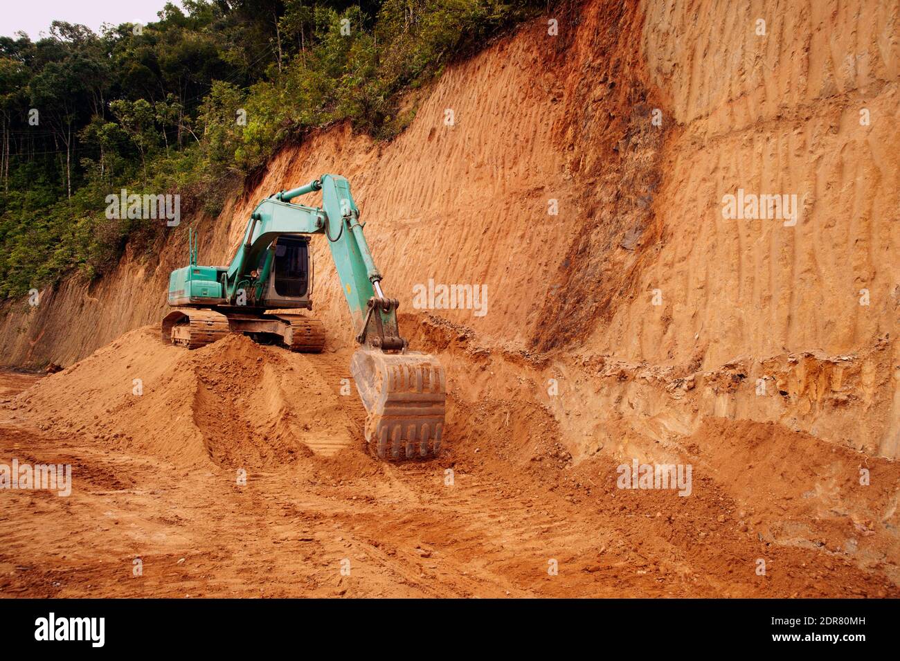Excavator during excavation at construction site. Excavator working ...