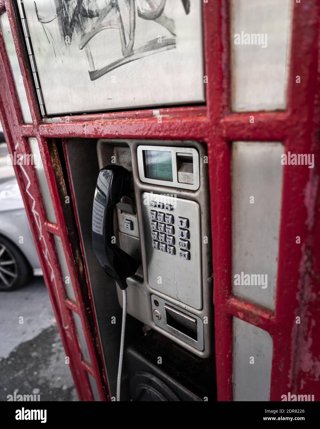 Red public inner city telephone box, United Kingdom Stock Photo - Alamy