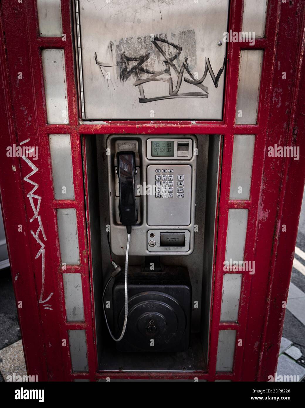 Red public inner city telephone box, United Kingdom Stock Photo - Alamy