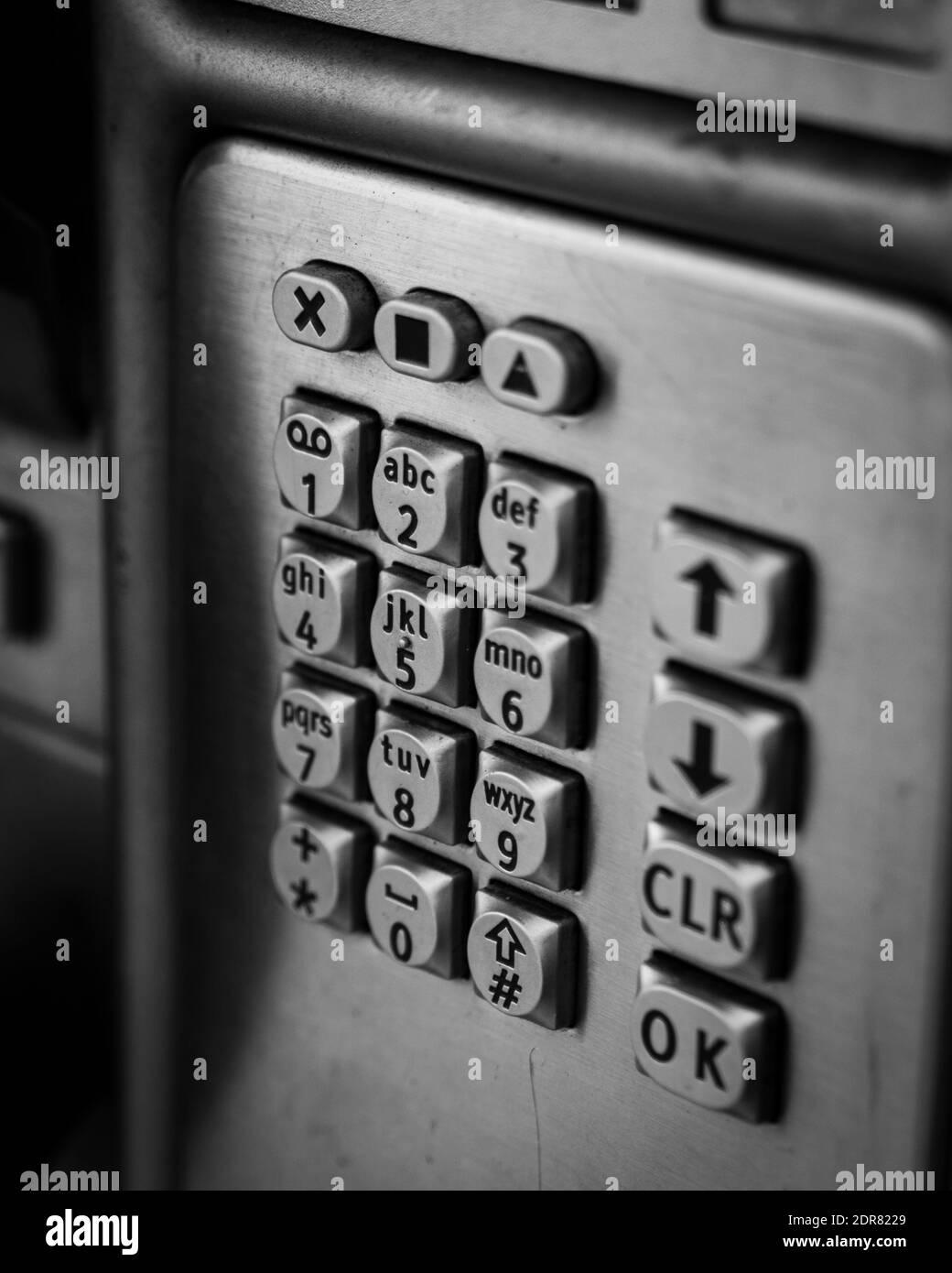 Metal payphone telephone numbered key pad buttons Stock Photo - Alamy