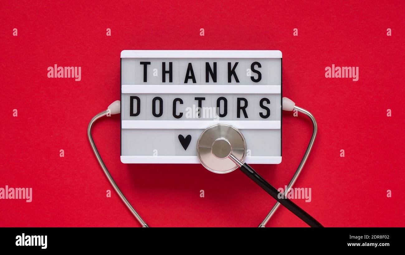 Text board for with text thank you doctors,stethoscope on red ...