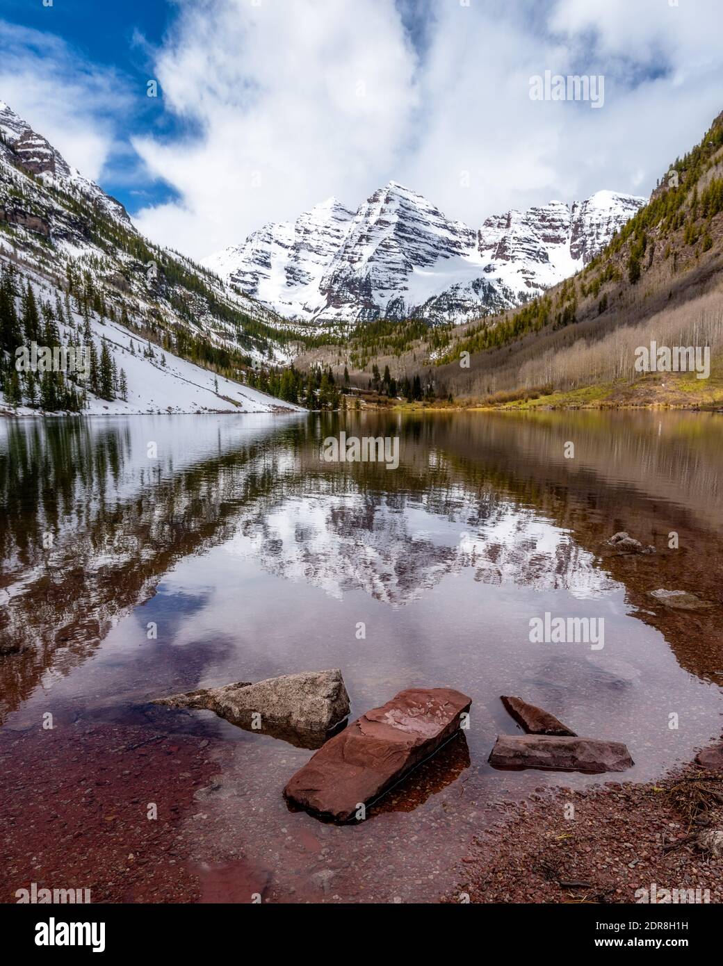 Spring reflection of Colorado Rocky mountains with snow Stock Photo - Alamy