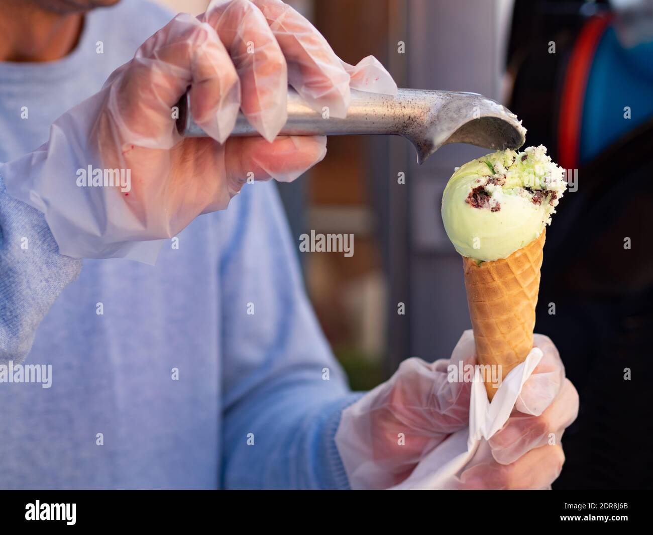 Hand scooping ice cream hi-res stock photography and images - Alamy