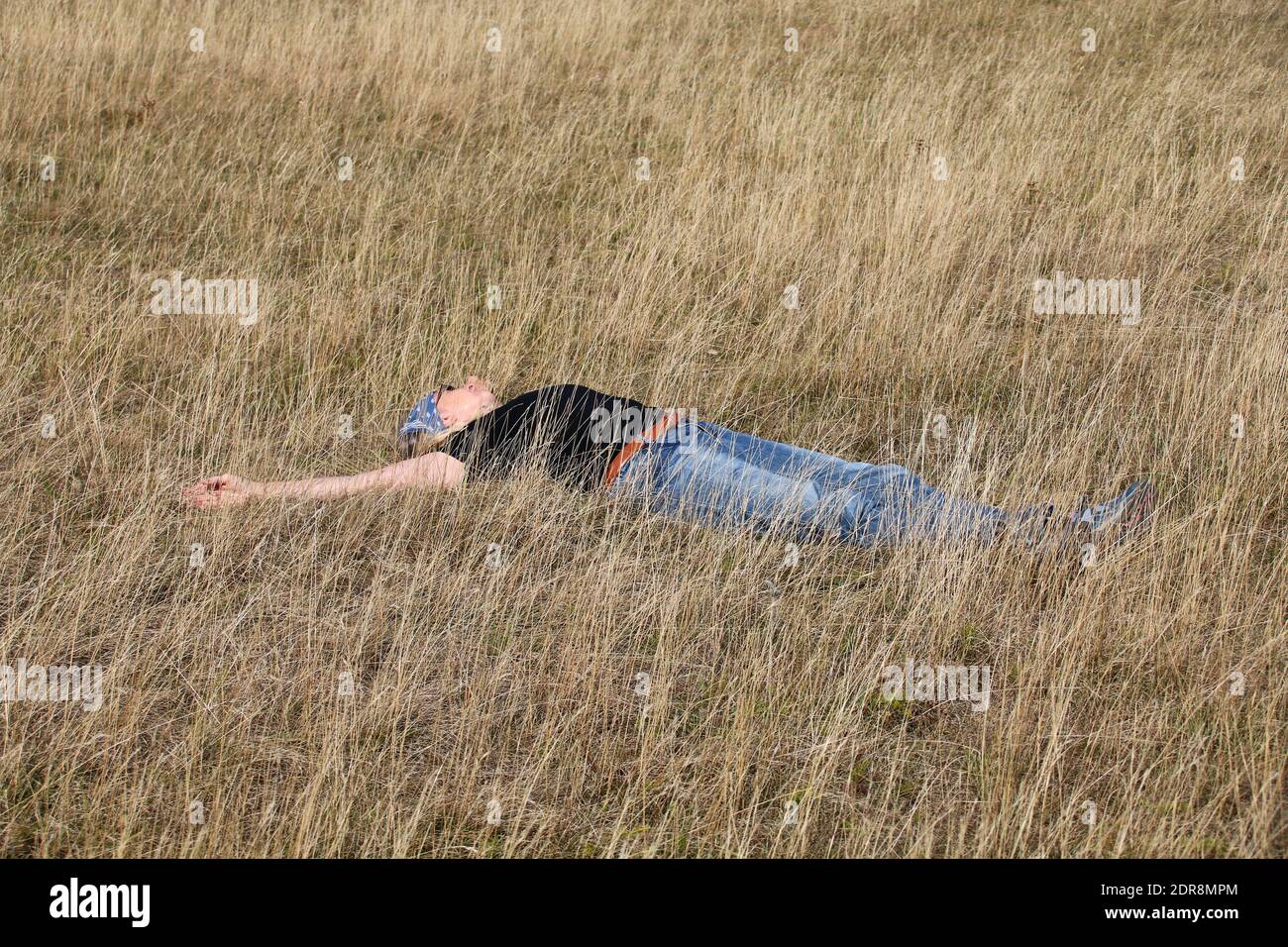 Man lying down arms outstretched hi-res stock photography and images ...