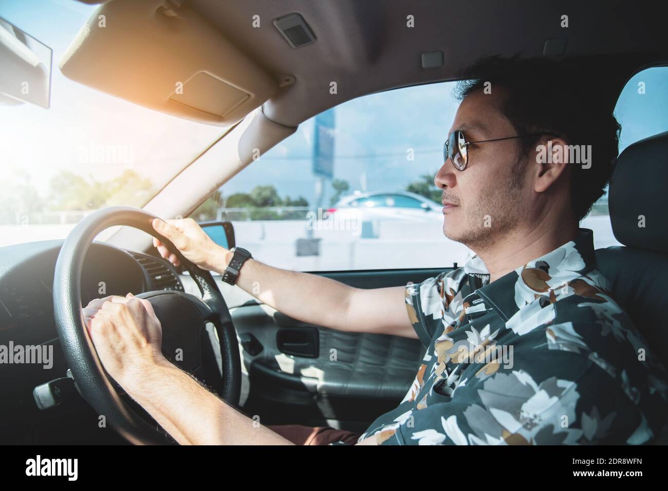 Indian man driving car in hi-res stock photography and images - Alamy