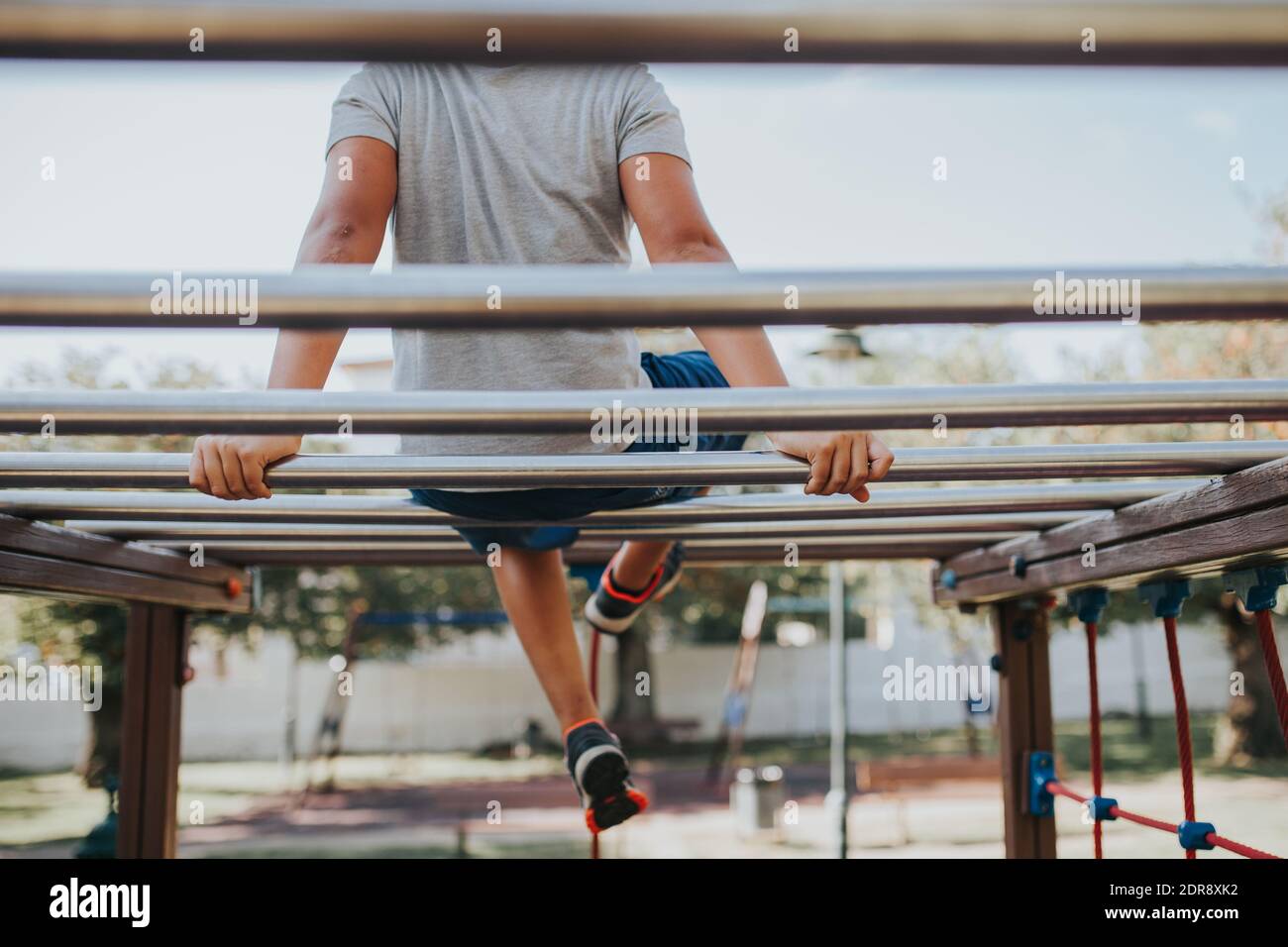 Man monkey bars playground hi-res stock photography and images - Alamy